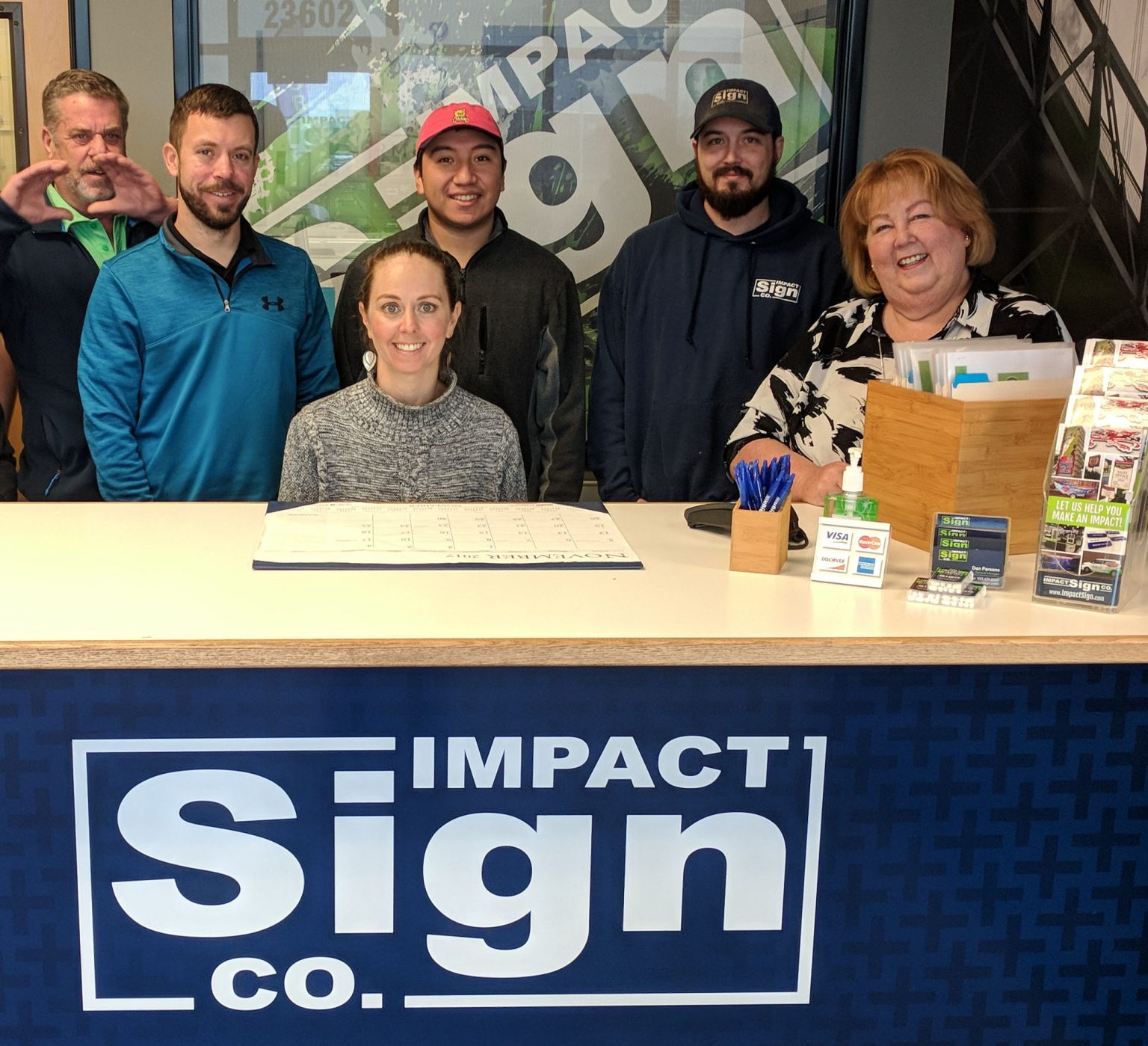 About - Impact Sign
